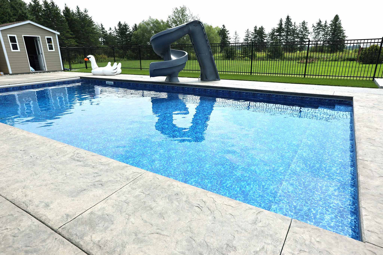 Inground Pool Installation Cumberland – Fun Design with Slide & Deck